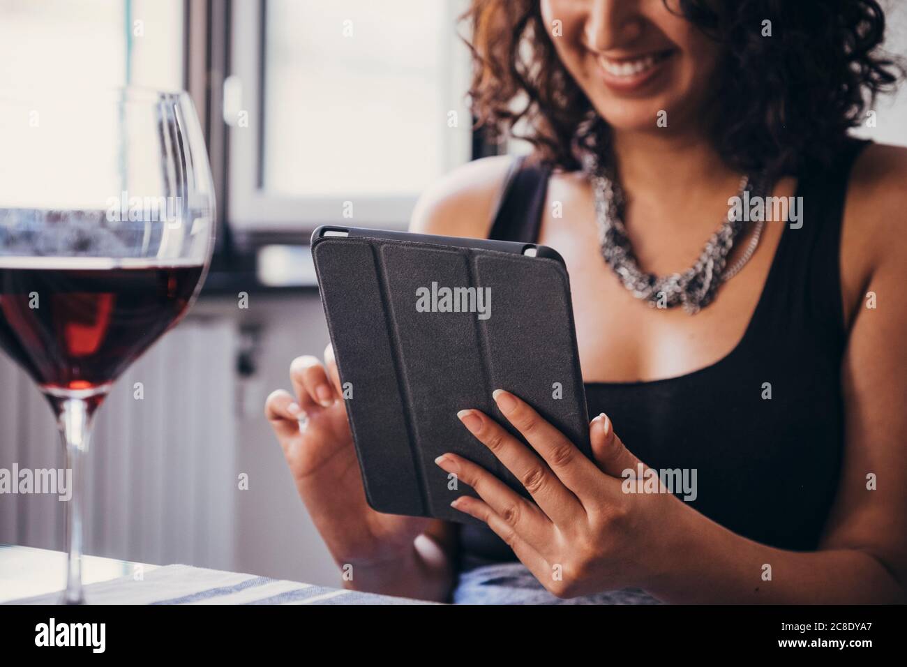 Young woman sitting dining table hi-res stock photography and images ...