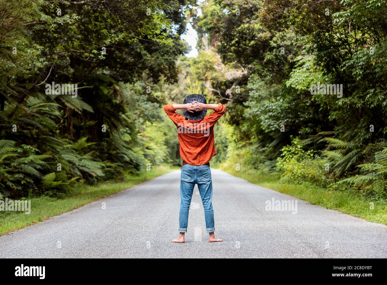 Man standing behind tree in hi-res stock photography and images - Alamy