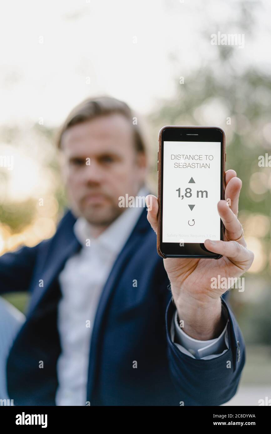 Hand holding smartphone displaying hi-res stock photography and images ...