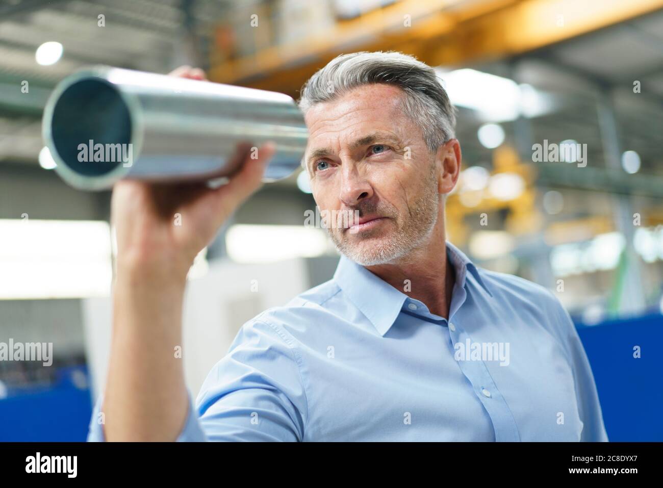 Man holding metal pipe hi-res stock photography and images - Alamy