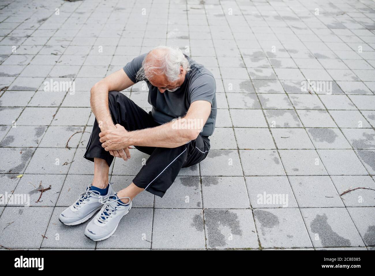 Image tired man sitting on hi-res stock photography and images - Alamy