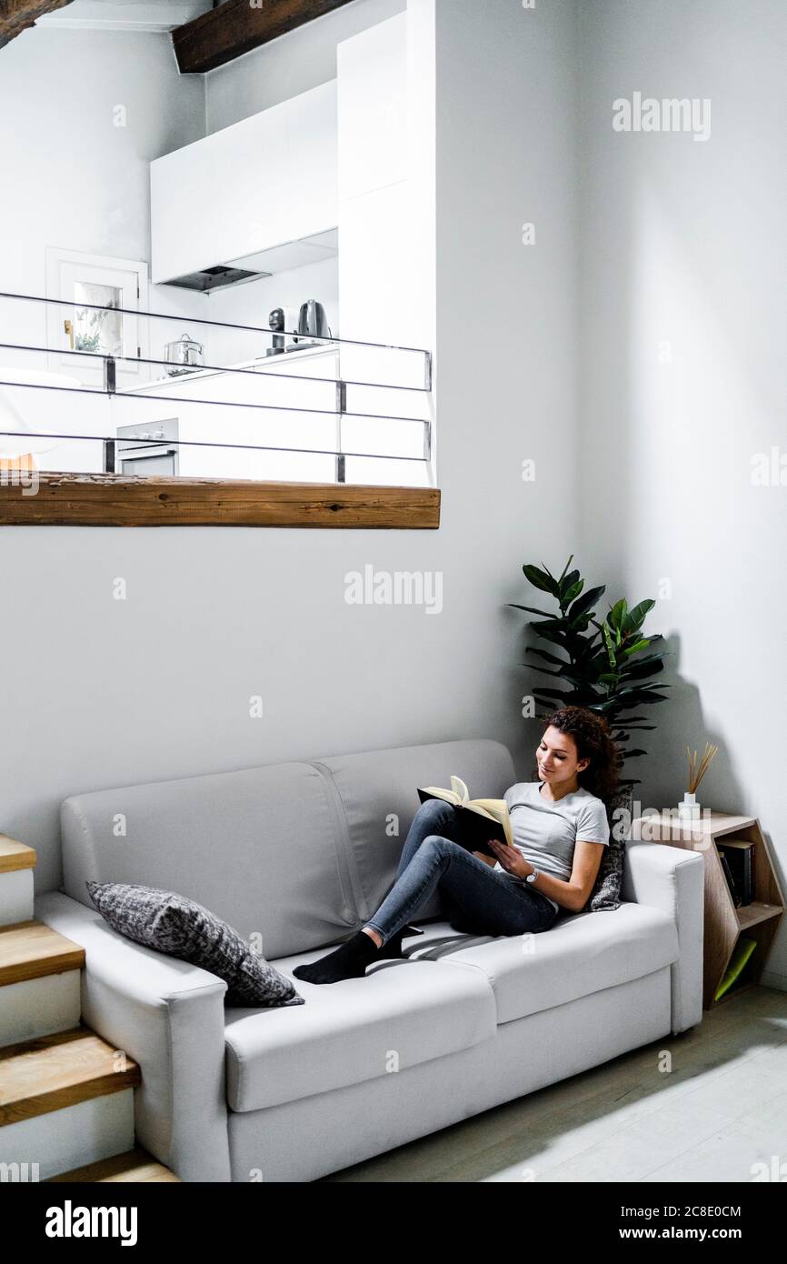 Woman sitting open book hi-res stock photography and images - Alamy