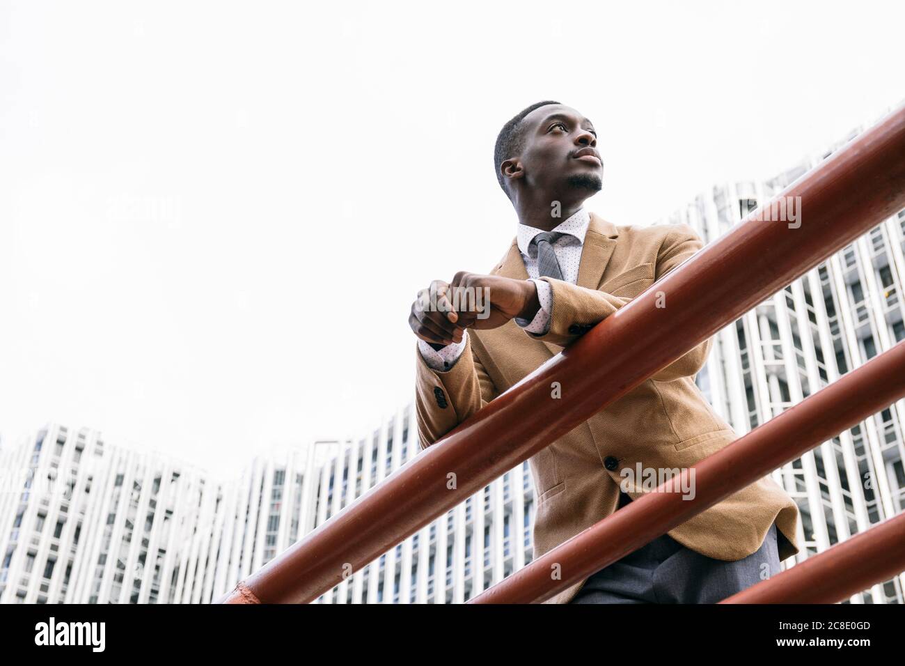 Elegant businessman leaning railing city hi-res stock photography and ...