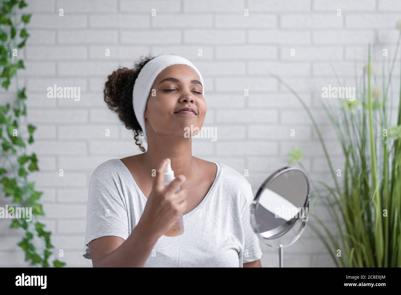 Spraying face mist hi-res stock photography and images - Alamy