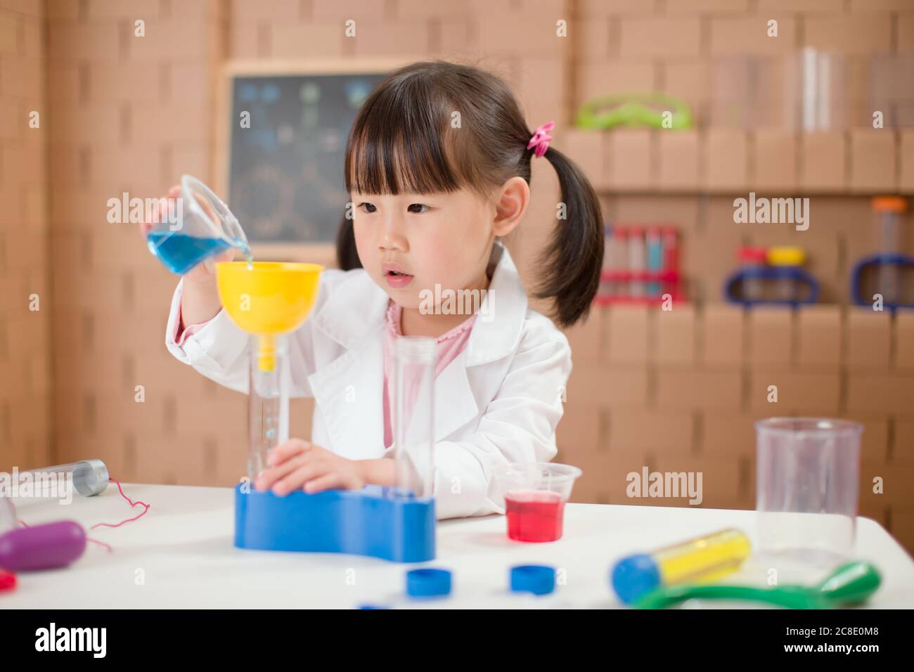 young girl play science experiments for home schooling Stock Photo - Alamy