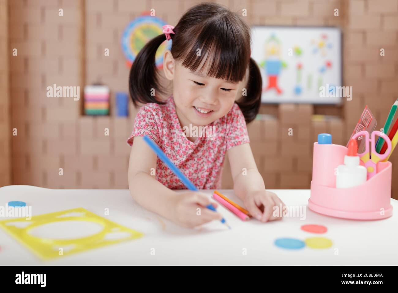 young girl practice drawing different shapes for home schooling Stock ...