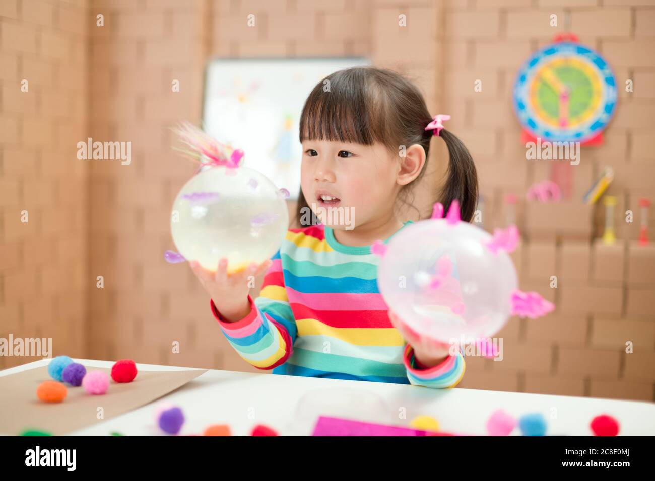 young girl making craft for home schooling Stock Photo - Alamy