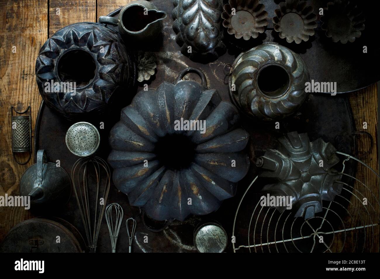 Collection of old rustic cooking utensils including baking pans, baking ...