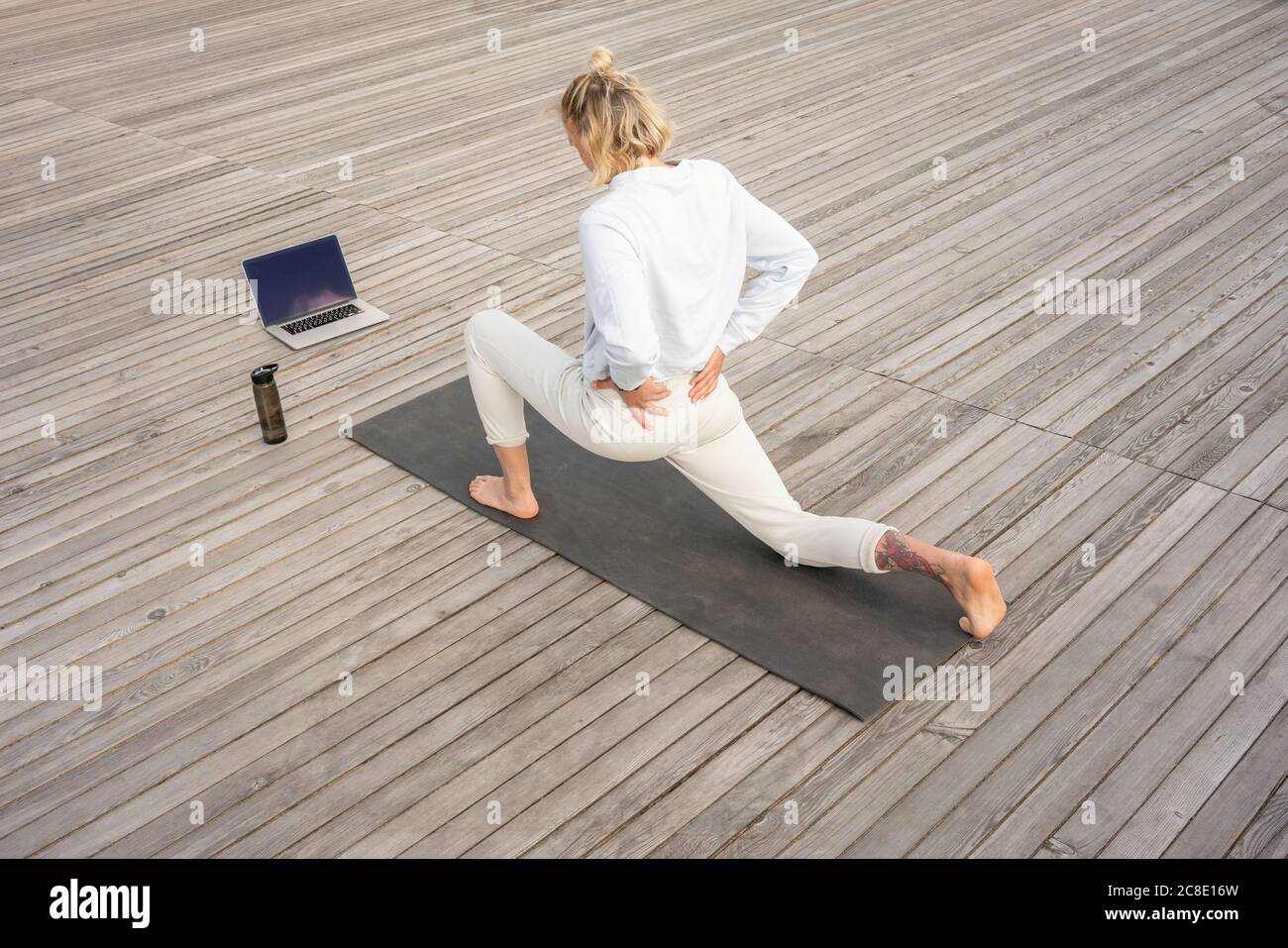 Woman exercises using laptop hi-res stock photography and images - Alamy