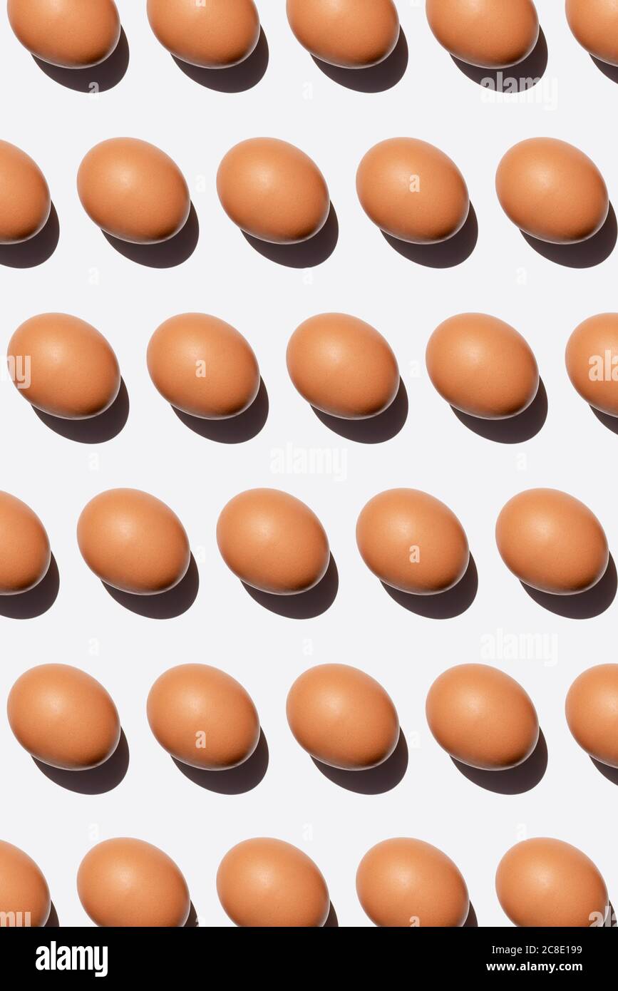 Pattern of chicken eggs against white background Stock Photo - Alamy