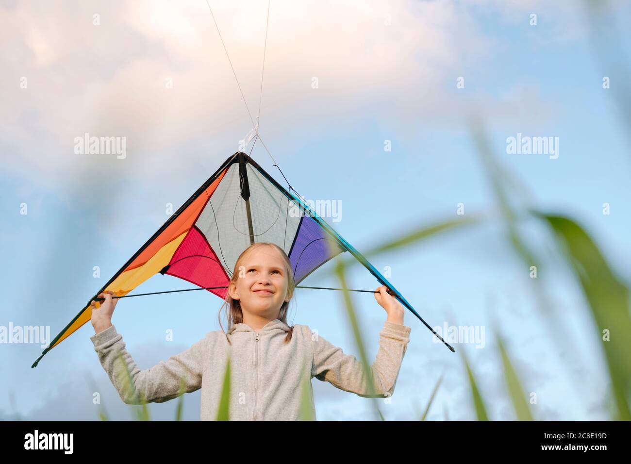 Girl holding kite hi-res stock photography and images - Alamy