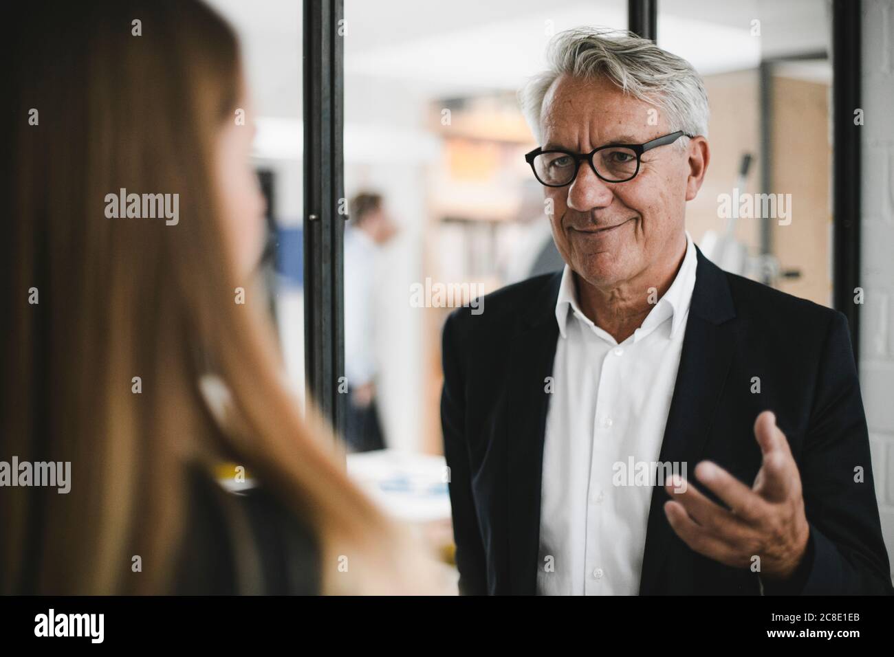 Positive senior talking young man hi-res stock photography and images ...
