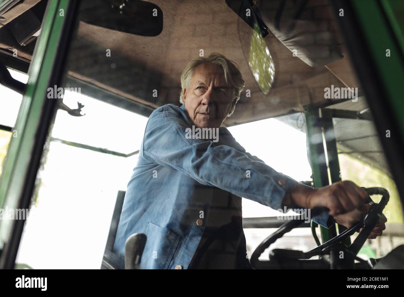 Grey tractor driving hi-res stock photography and images - Alamy