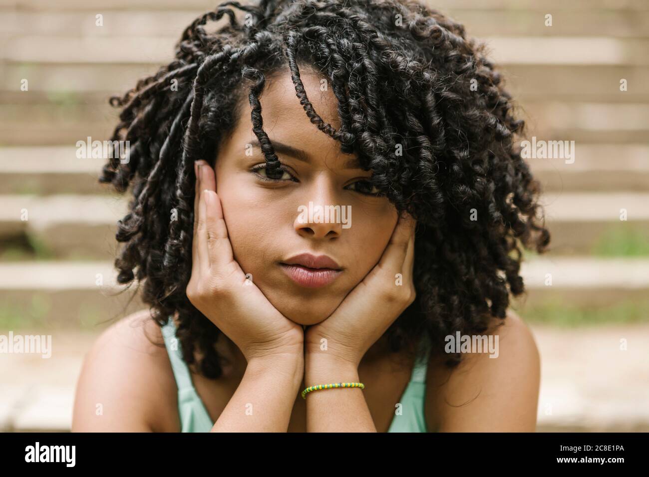 Leaning on the chin with both hands hi-res stock photography and images ...