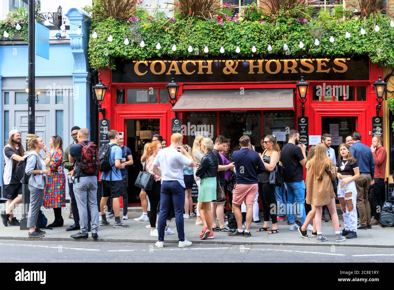 London, UK. 23rd July, 2020. A fairly large number of people drink and ...