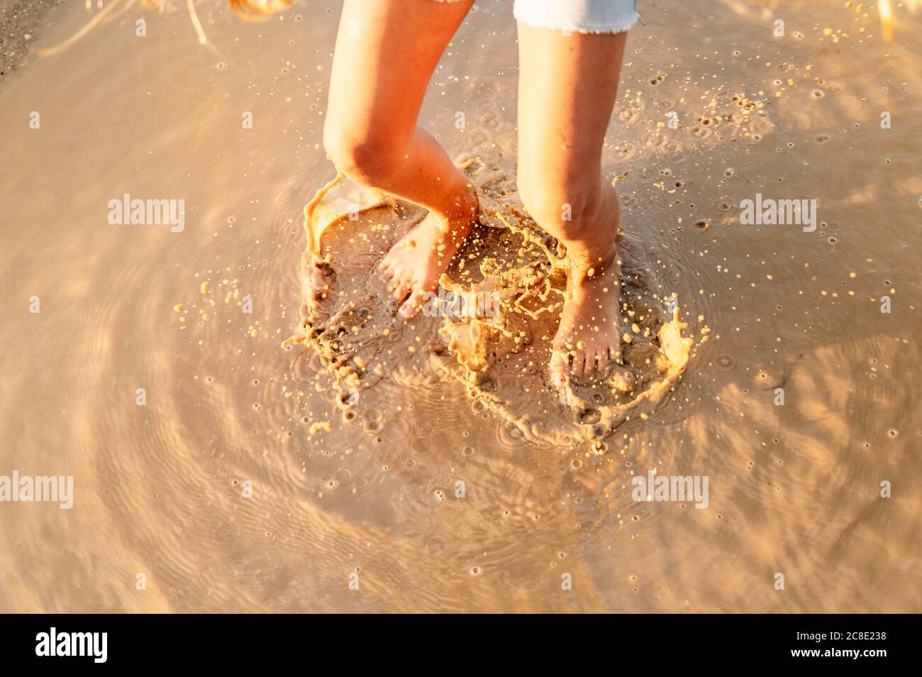 Child jumping water splashing barefoot hi-res stock photography and ...