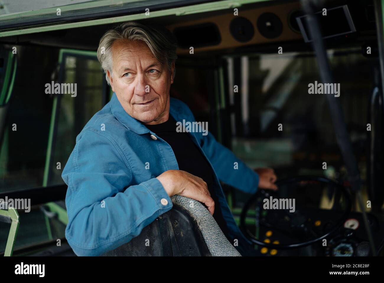 Man driving tractor hi-res stock photography and images - Alamy
