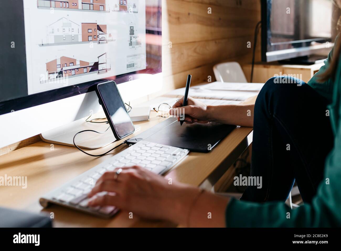 Female architect using computer at home Stock Photo - Alamy