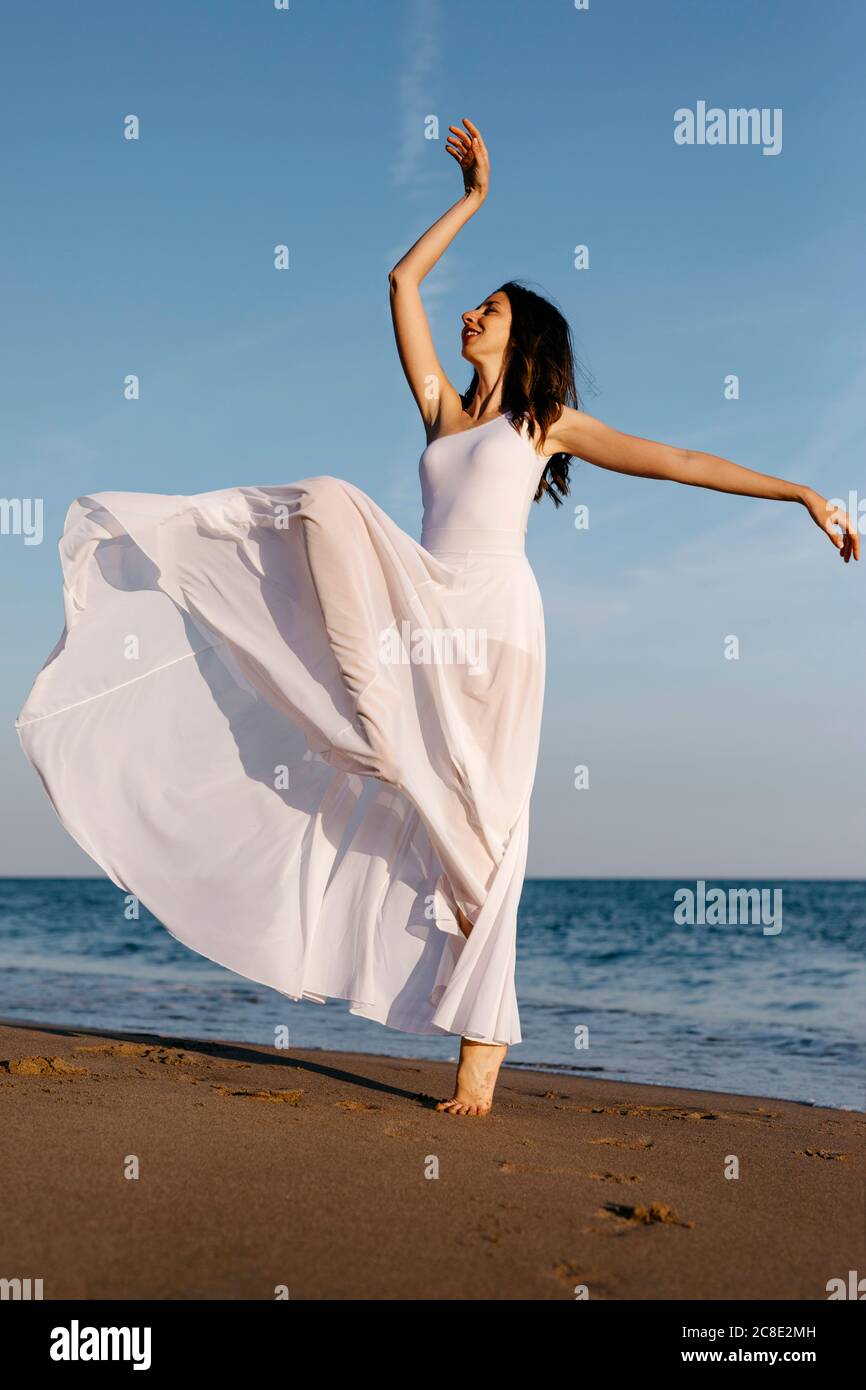 Ballerina in white dress dancing at the sea Stock Photo - Alamy