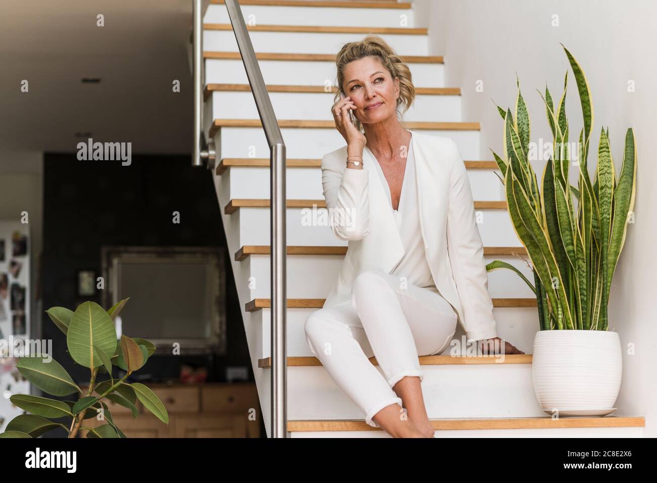 Attractive mature businesswoman working on hi-res stock photography and ...