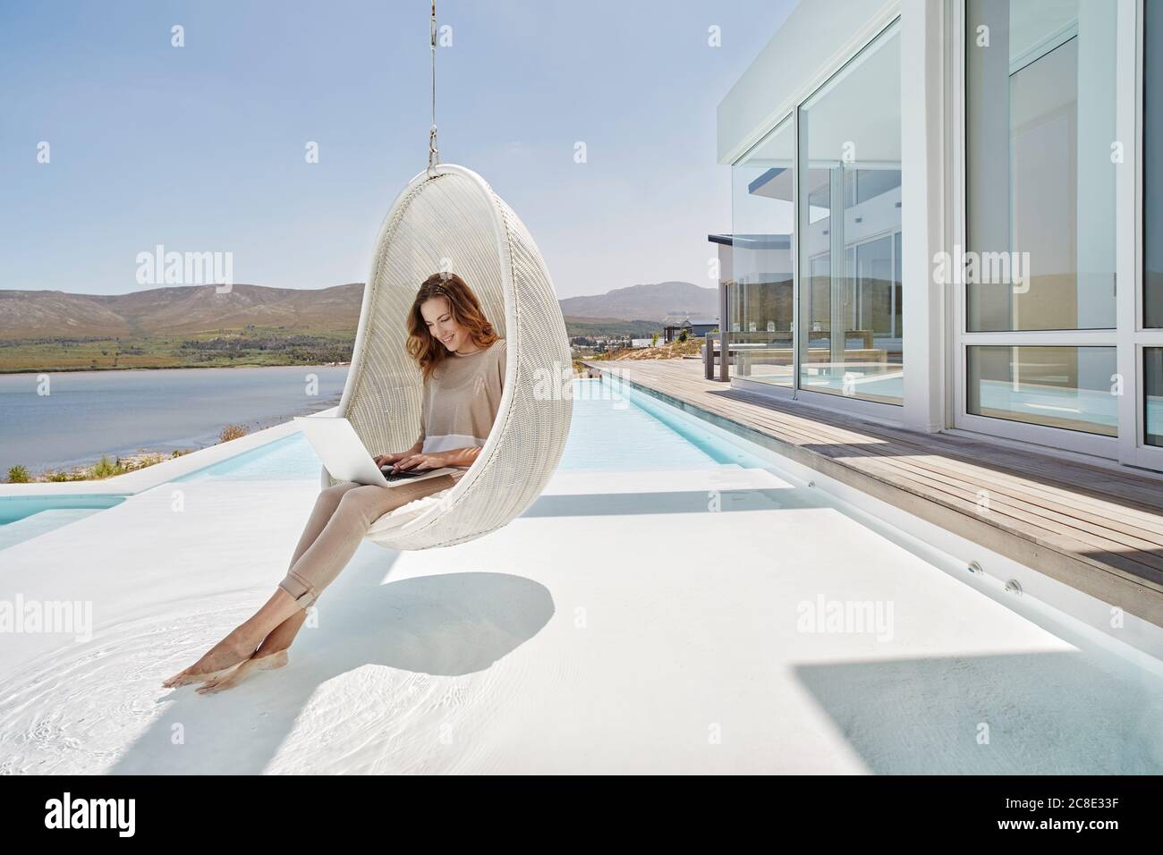 Using computer in swimming pool hi-res stock photography and images - Alamy