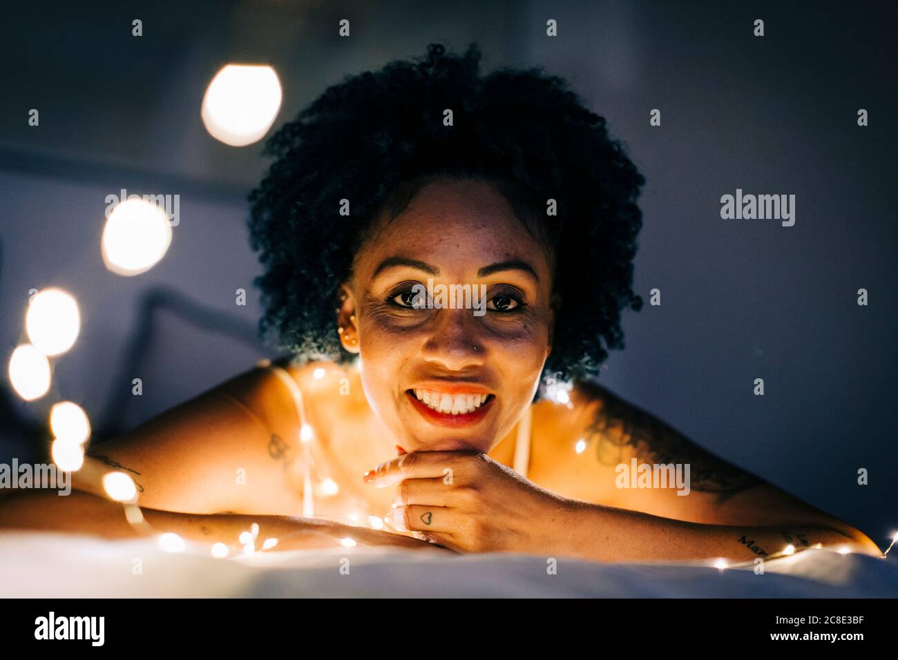 Woman bed smiling hi-res stock photography and images - Alamy