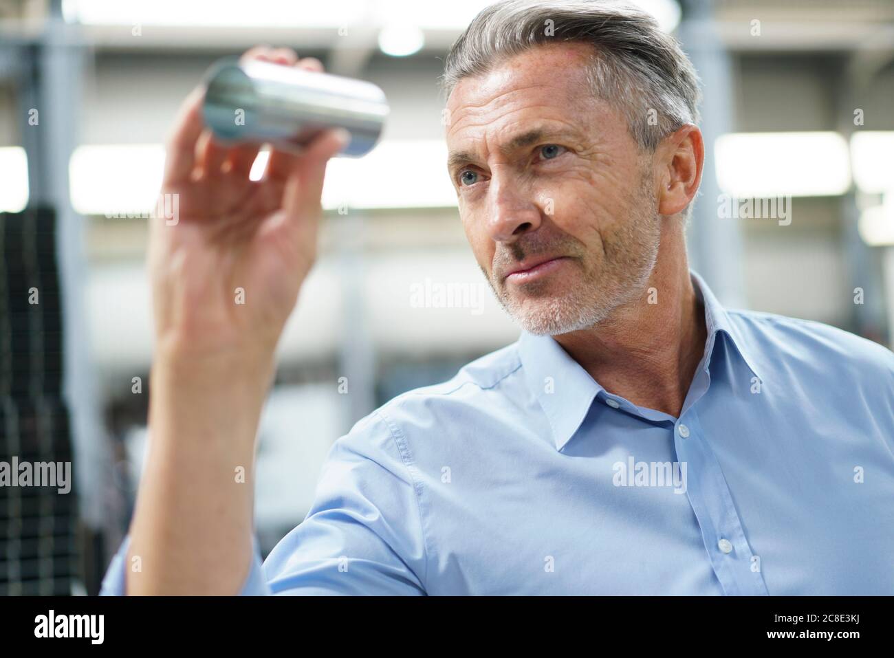 Man holding metal pipe hi-res stock photography and images - Alamy