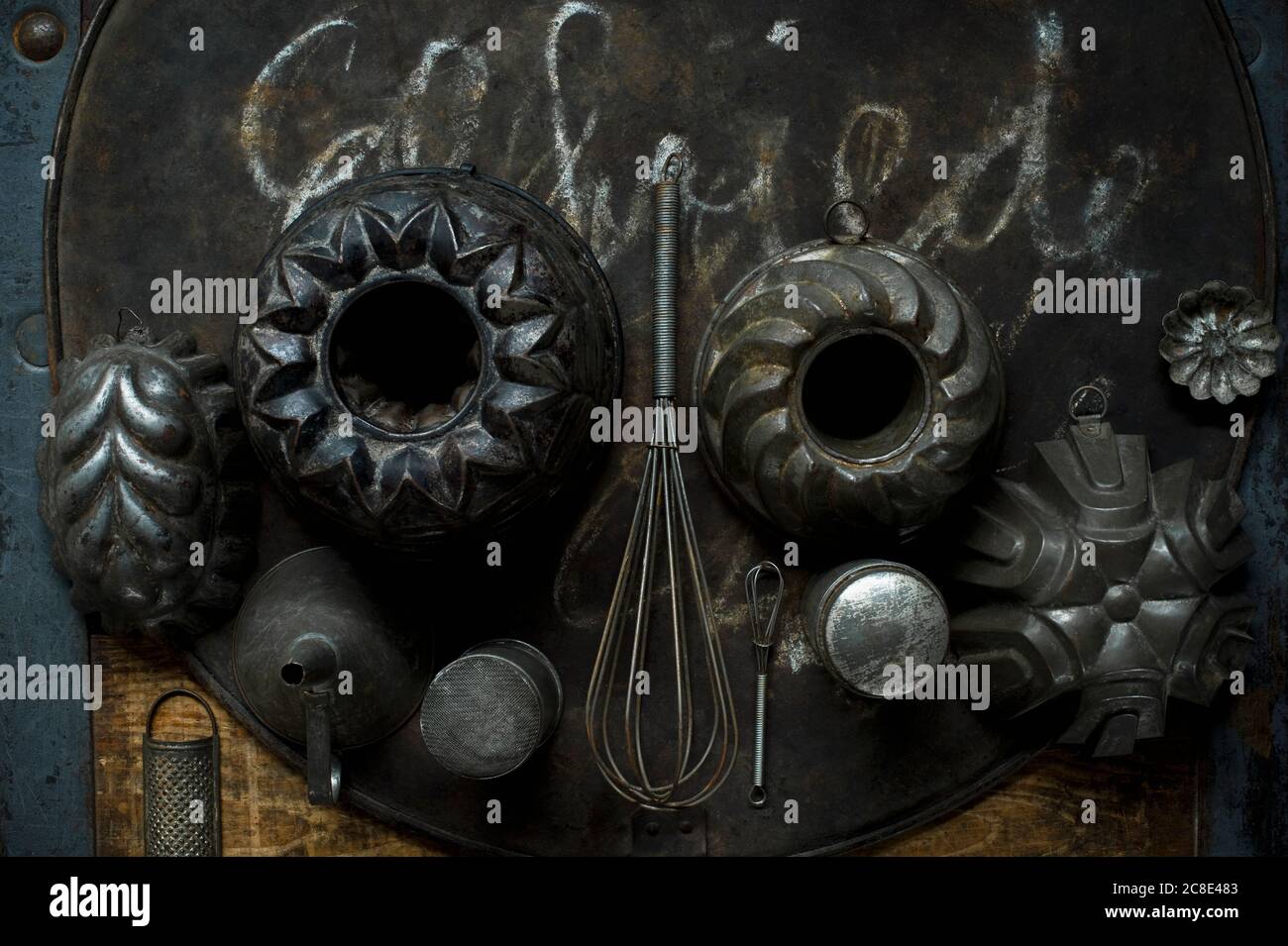 Collection of old rustic cooking utensils including baking pans, baking ...