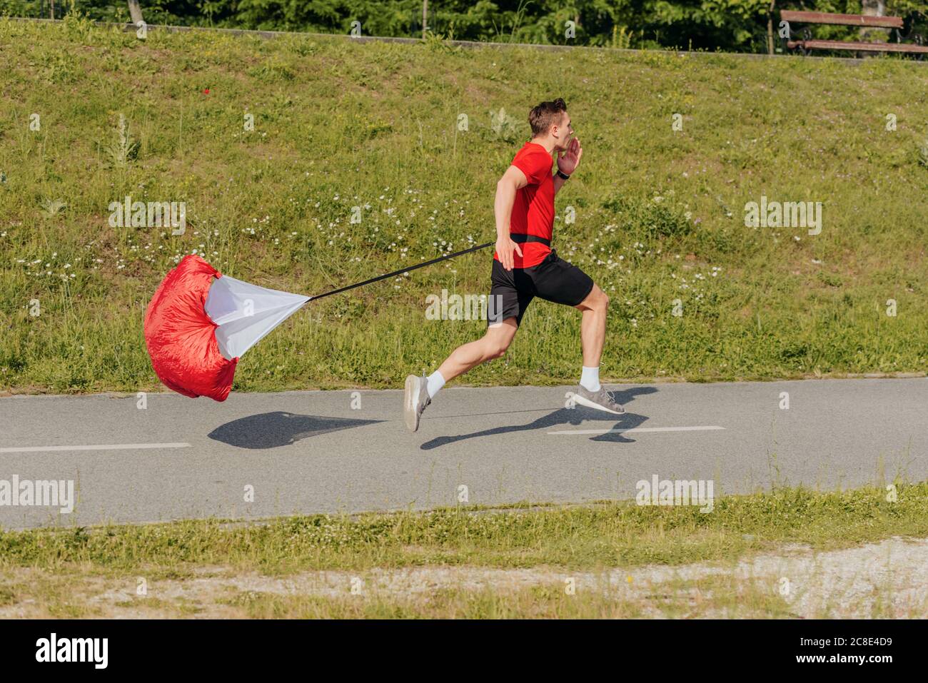Athlete man running with parachute hi-res stock photography and images ...