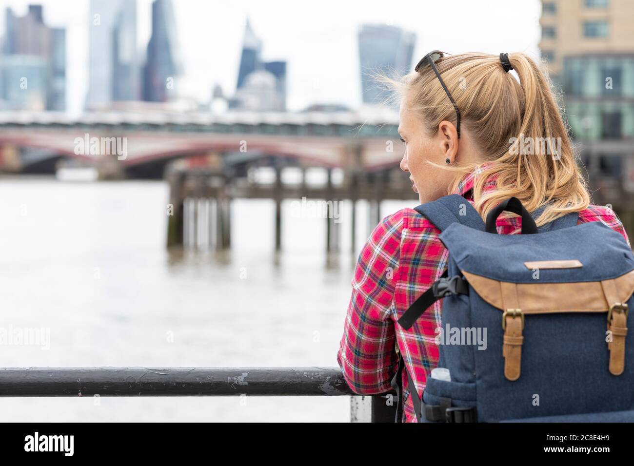 Back view woman carrying backpack hi-res stock photography and images ...