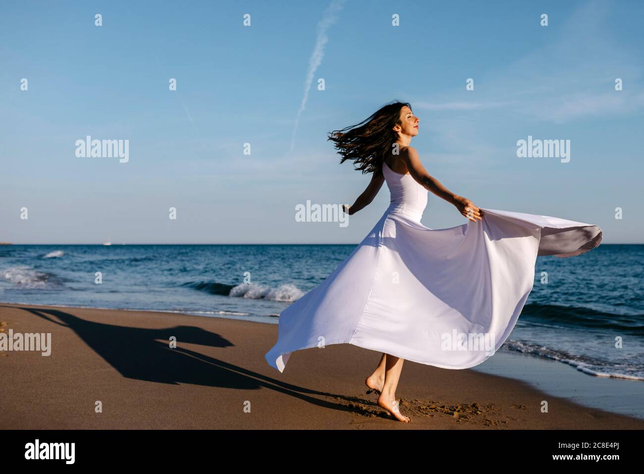 Ballerina in white dress dancing at the sea Stock Photo - Alamy