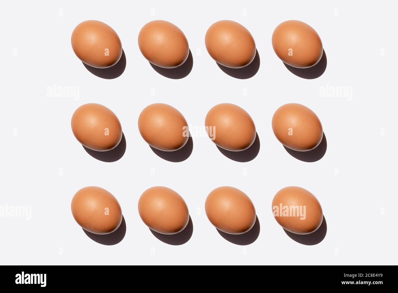 Pattern of chicken eggs against white background Stock Photo - Alamy