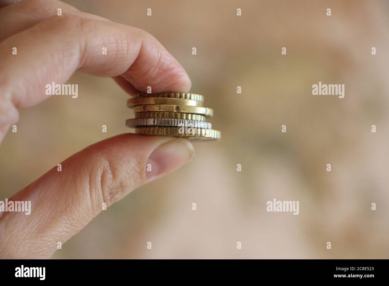 Young man putting coins in hi-res stock photography and images - Alamy