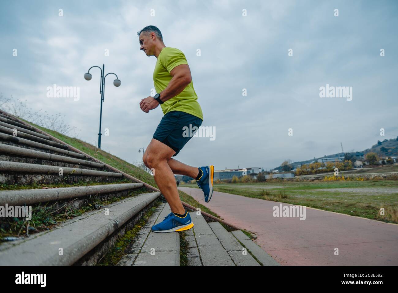 Mature man running up stairs hi-res stock photography and images - Alamy