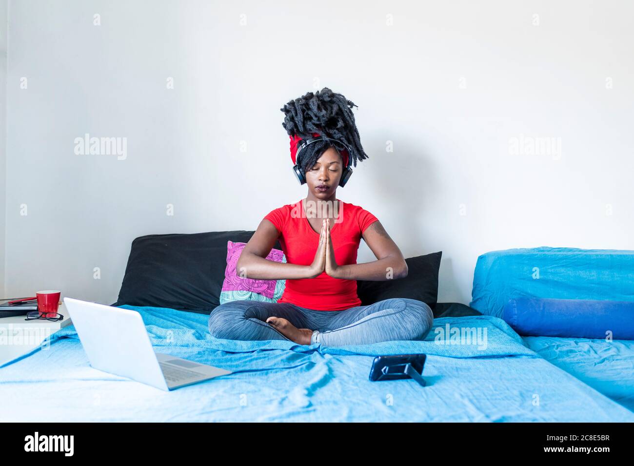 Person on computer meditating hi-res stock photography and images - Alamy