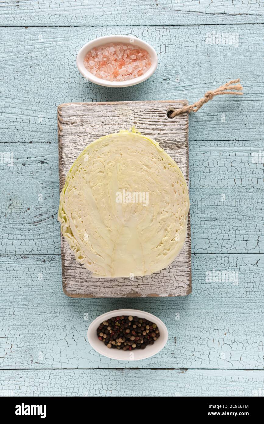 Cabbage fermenting ingredients on blue wooden vertical textured ...