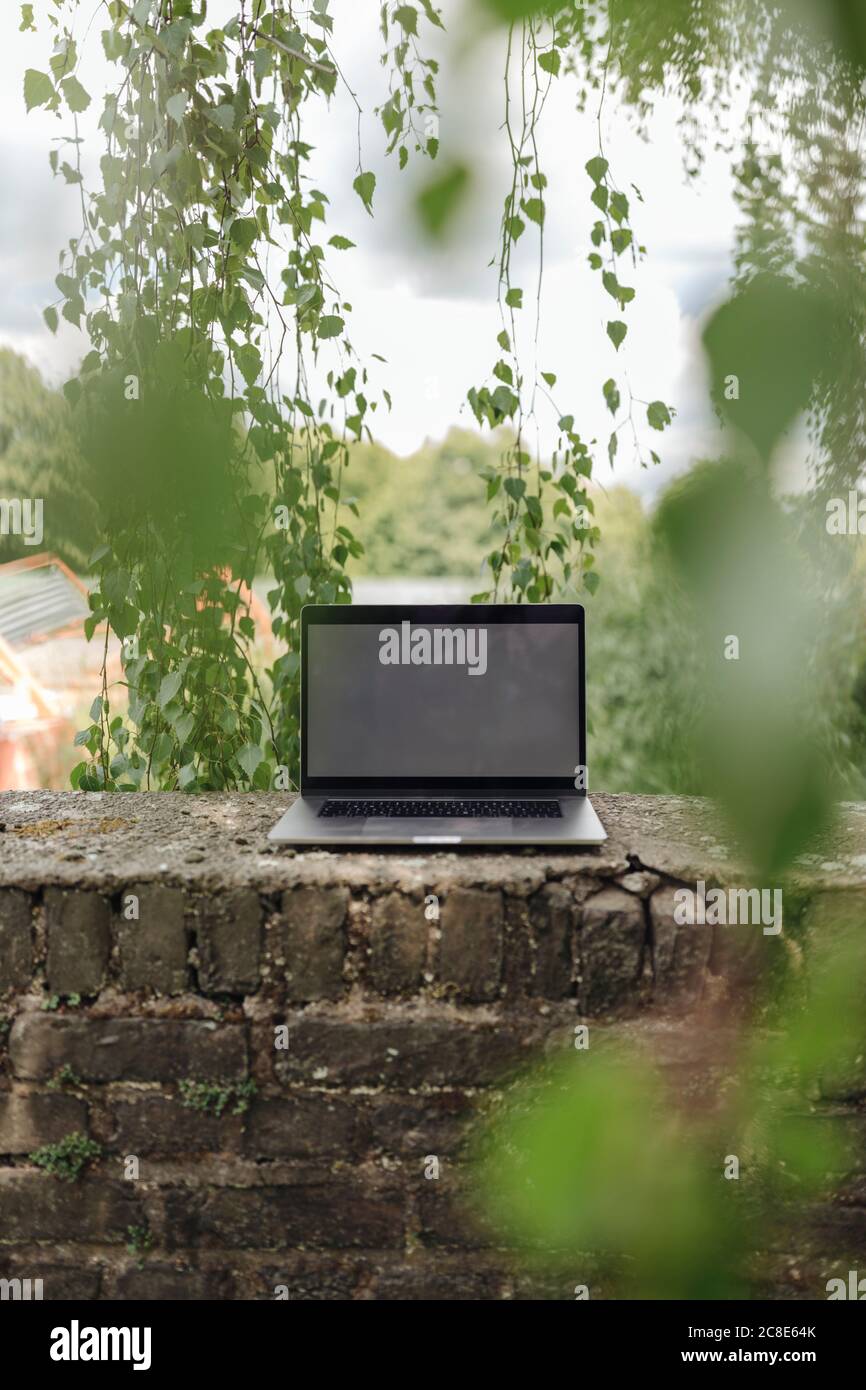Laptop on the wall hi-res stock photography and images - Alamy