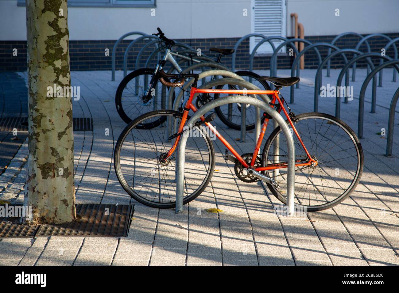bikes or cycles locked up to a cycle rack in the street Stock Photo - Alamy