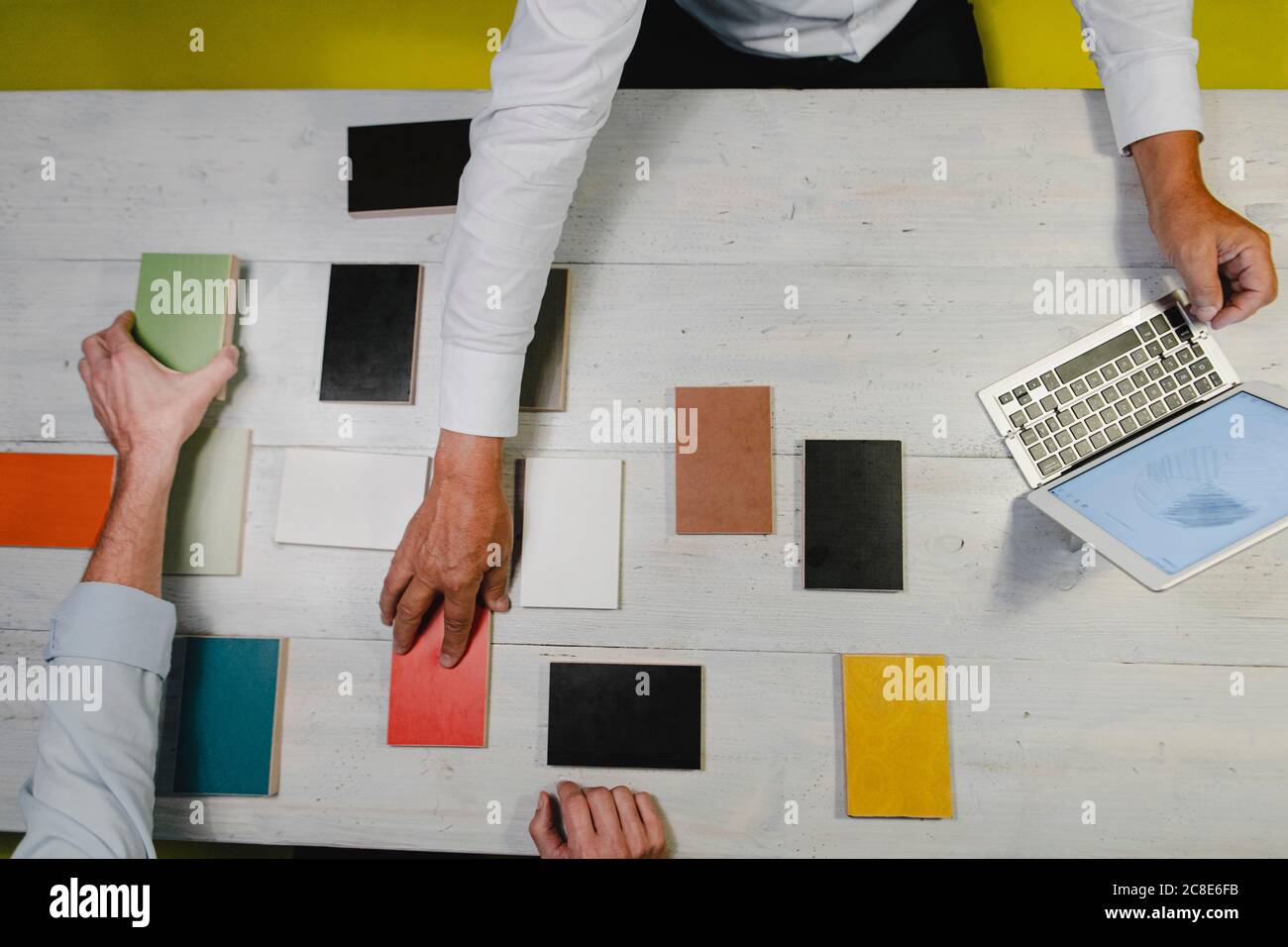 Hands of architects choosing colour samples in office Stock Photo - Alamy