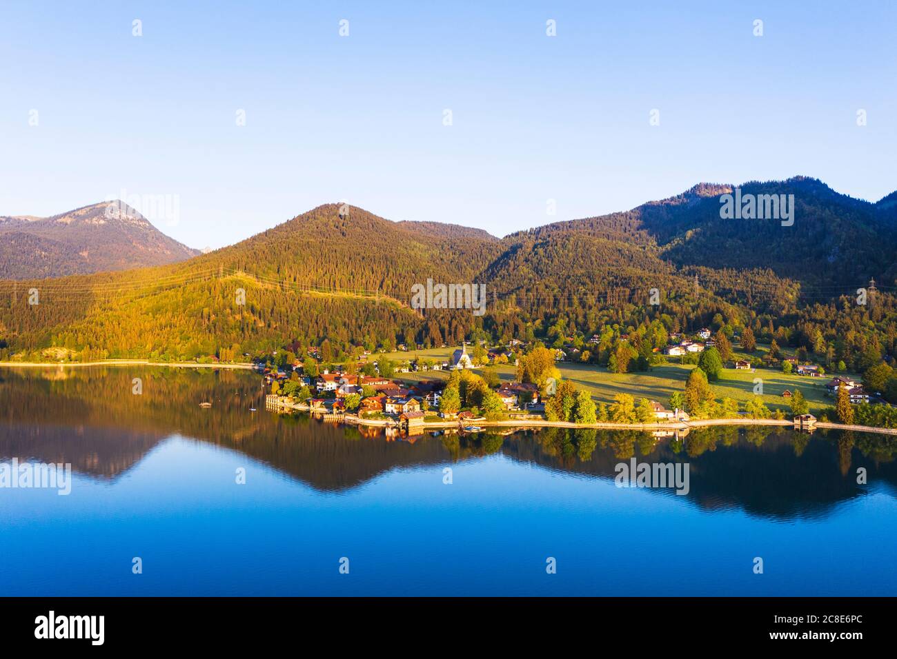 Germany, Bavaria, Kochel am See, Drone view of village on shore of Lake Walchen at springtime ...