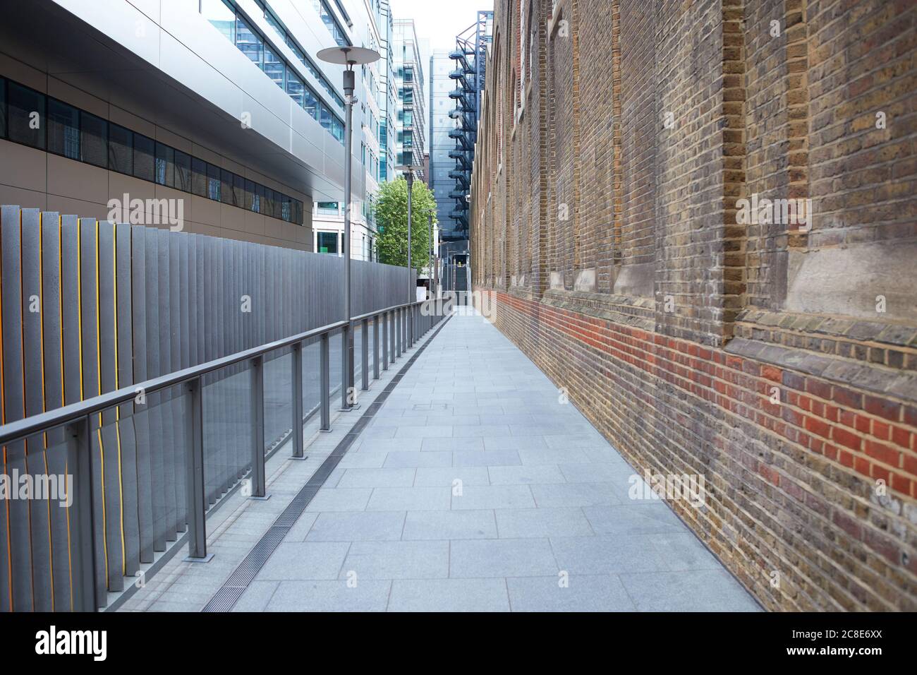 Empty alley along brick building hi-res stock photography and images ...