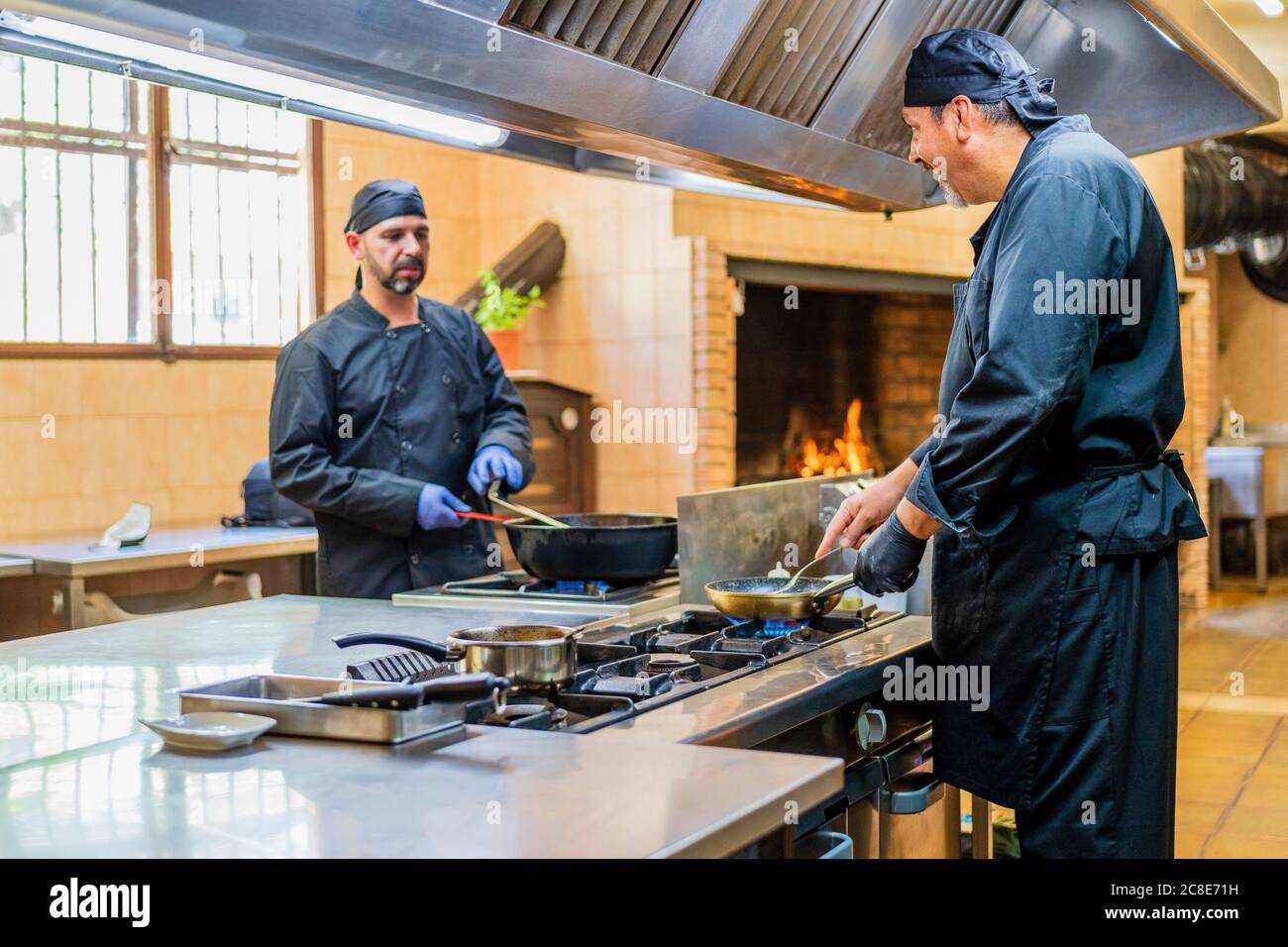 Traditional cooking in restaurant kitchen Stock Photo - Alamy