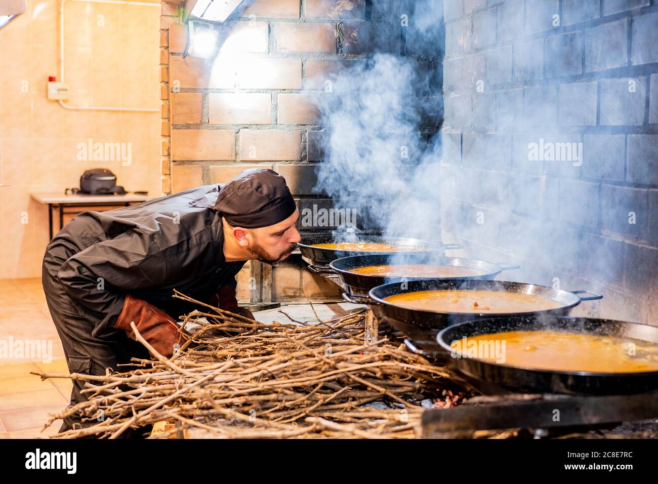 Traditional cooking of paella in restaurant kitchen Stock Photo - Alamy