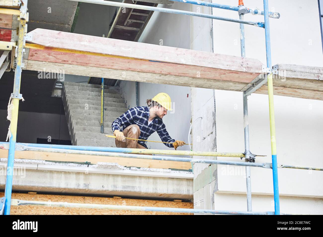 Construction worker working on a construction site hi-res stock ...