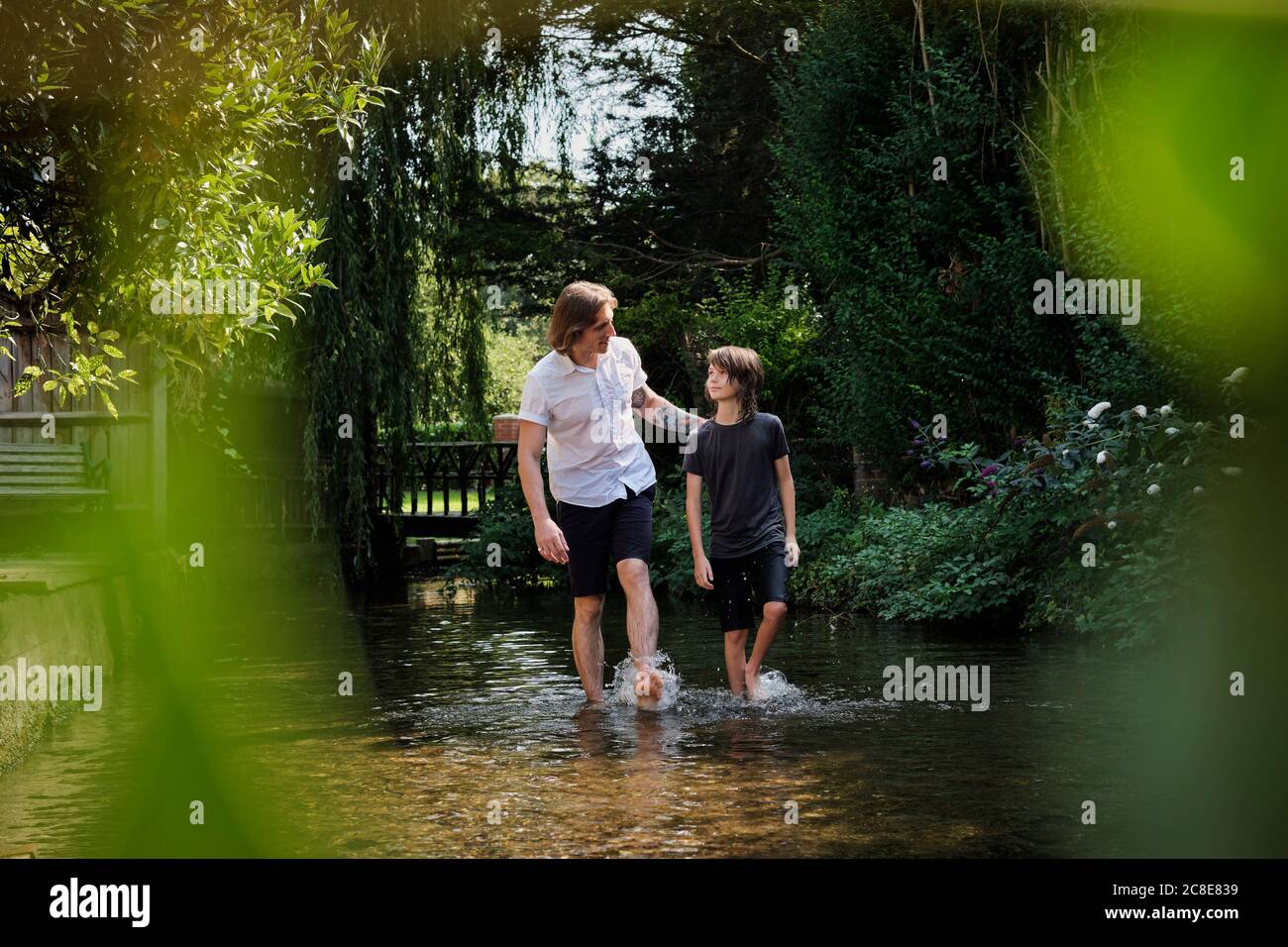 Child walking water in stream hi-res stock photography and images - Alamy