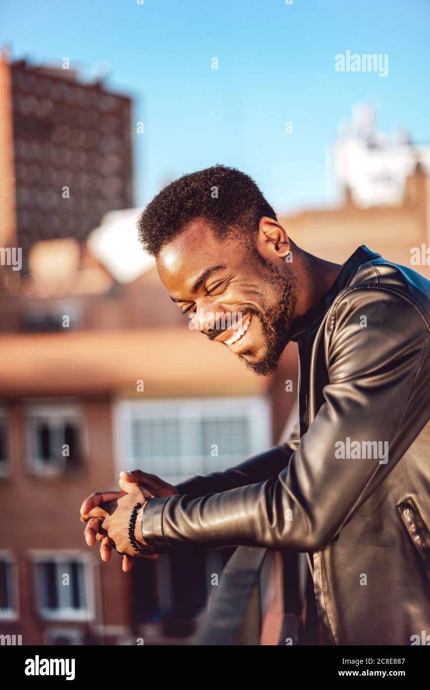 Man on railing hi-res stock photography and images - Alamy