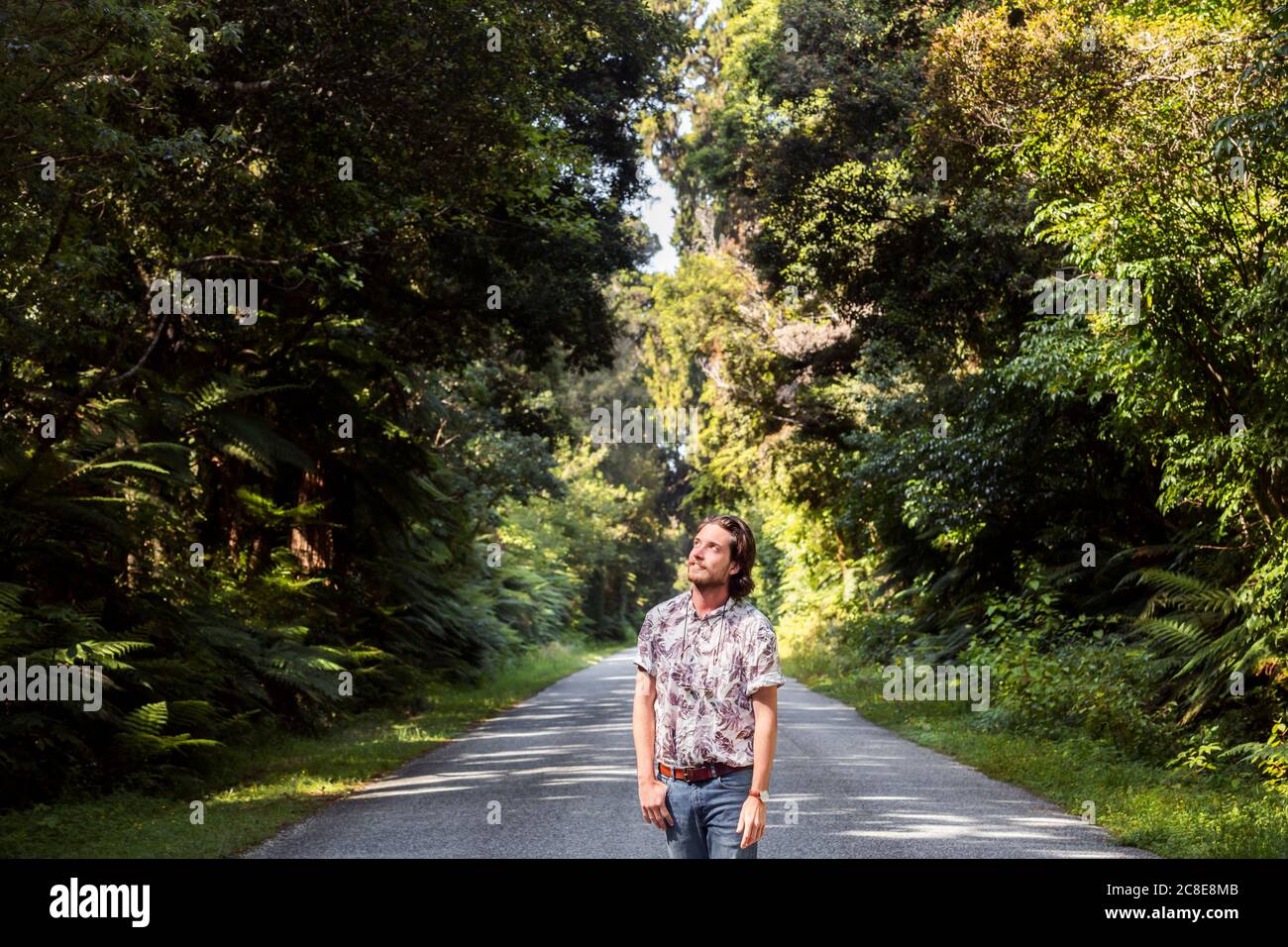 Man standing on road looking at view hi-res stock photography and ...