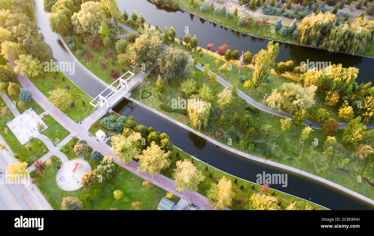 Aerial view of city. River, bridge, trees and building can be seen ...