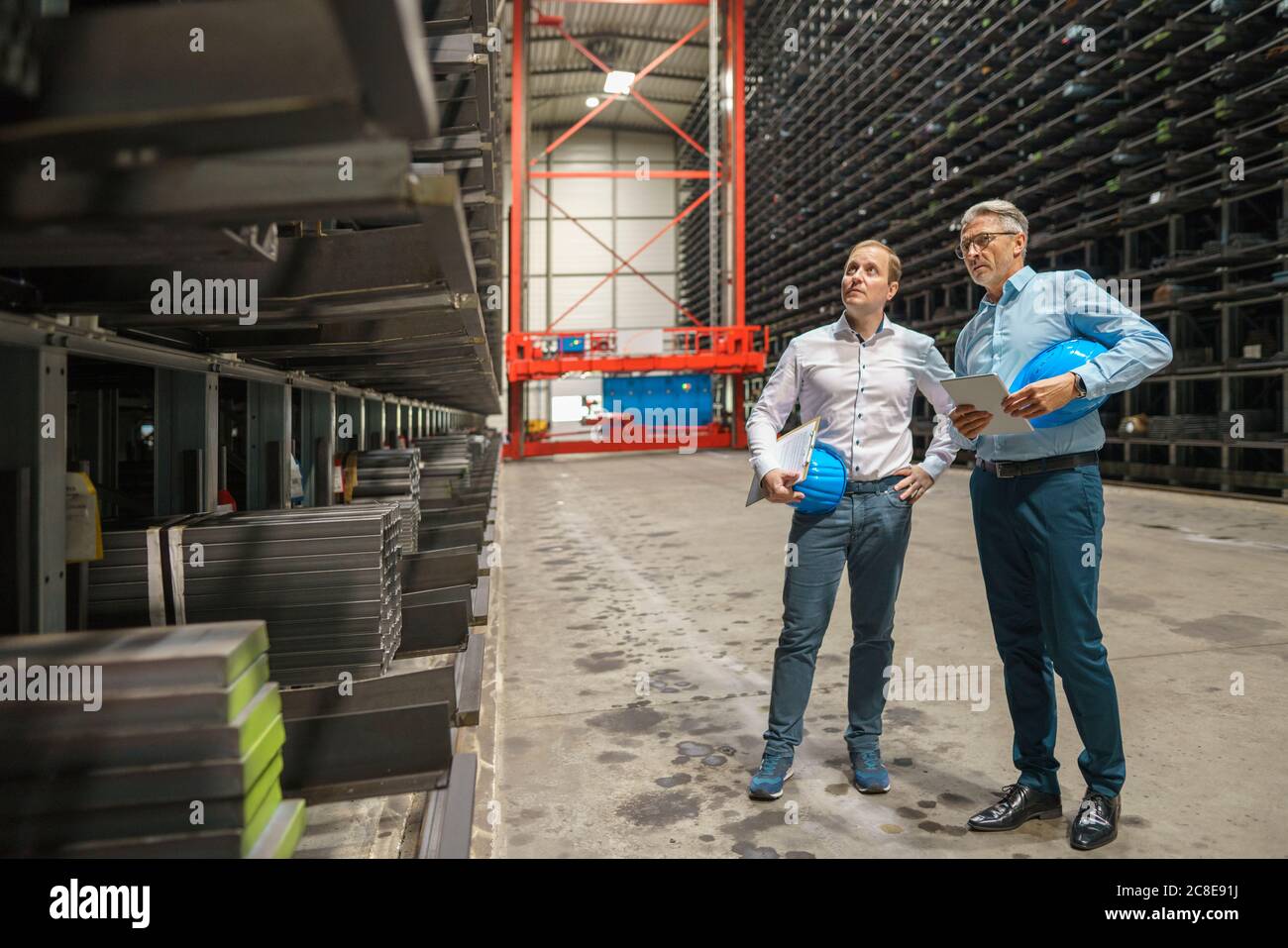 Two businessmen in warehouse hi-res stock photography and images - Alamy