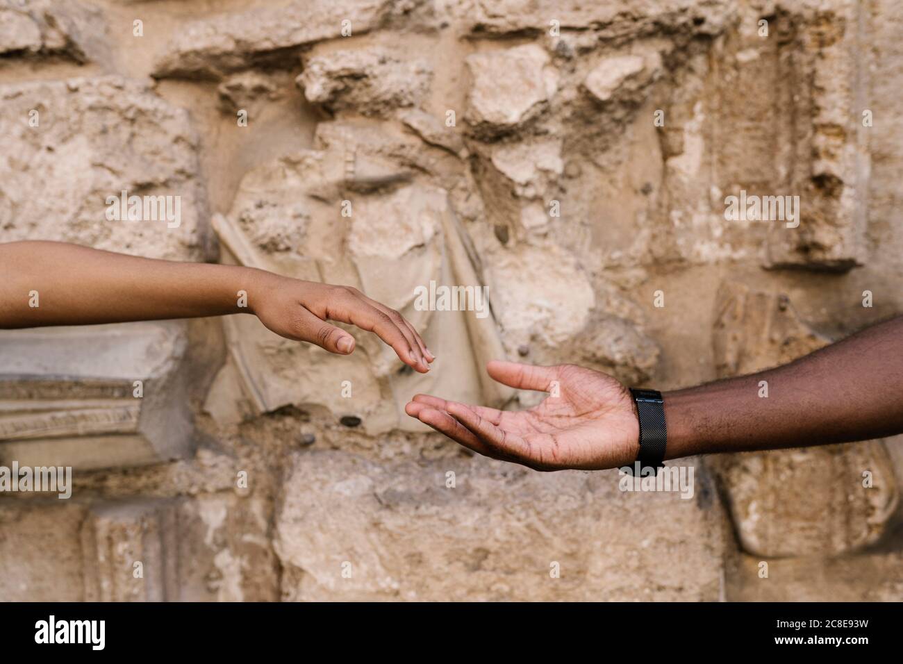 Two hands reaching hi-res stock photography and images - Alamy